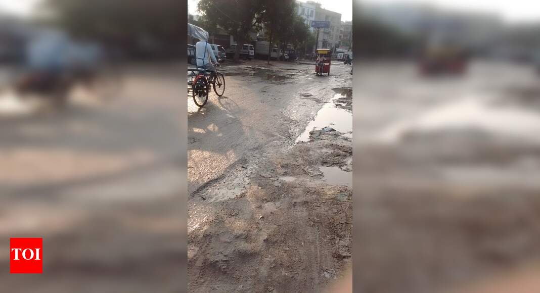 Potholed road - Times of India