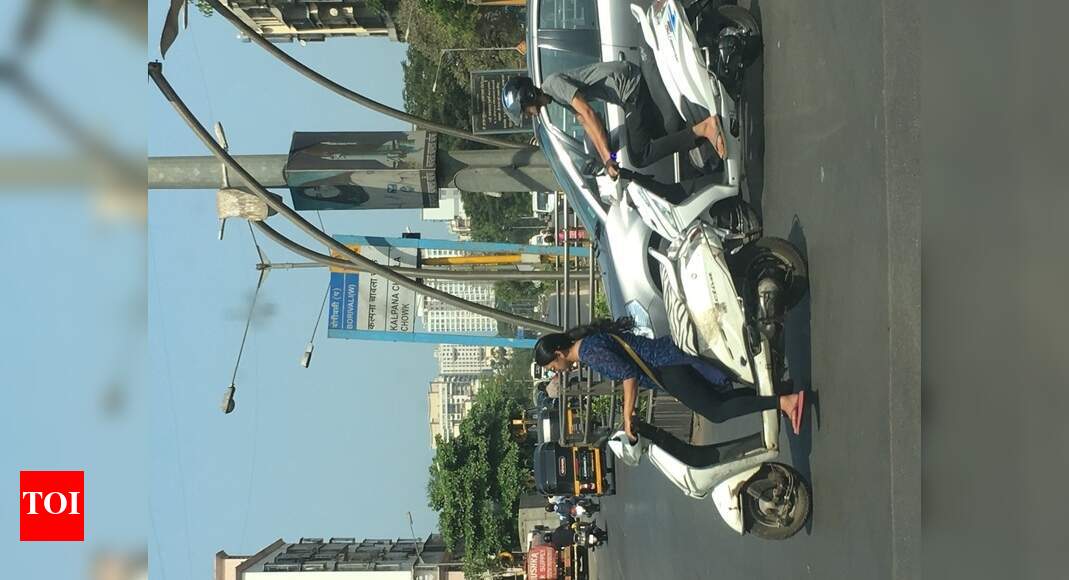 Signal covered by hoarding or name plate - Times of India