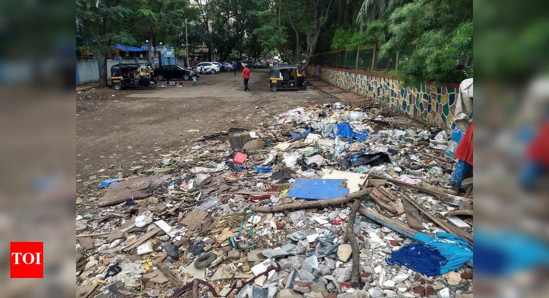 piled up garbage in residential area - Times of India