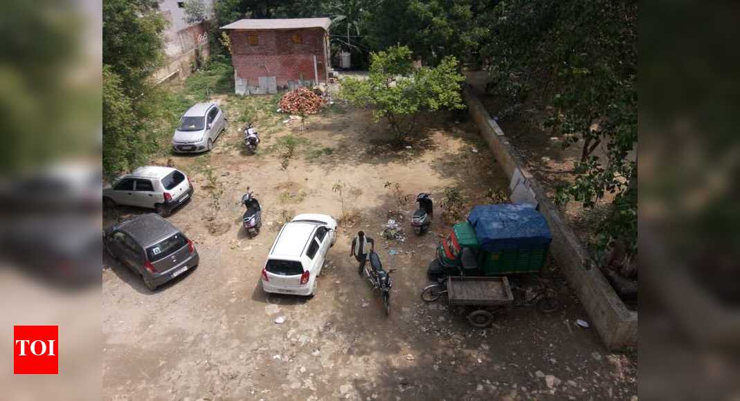 Encroachment of DDA parking space - Times of India