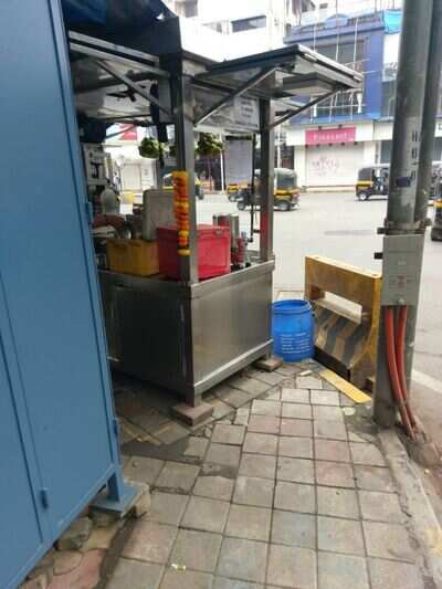 licensed stall on footpath - Times of India