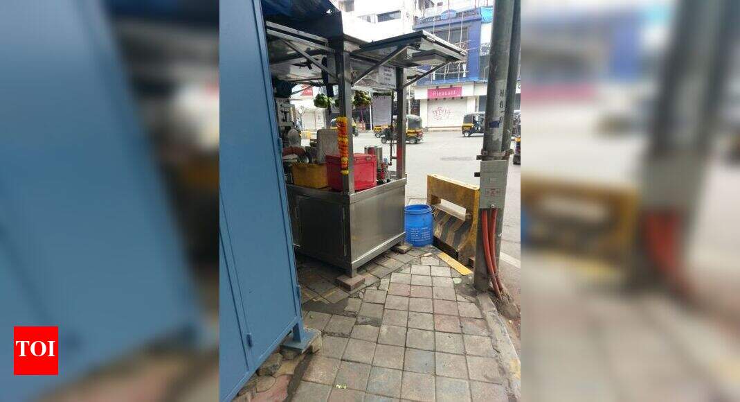 licensed stall on footpath - Times of India