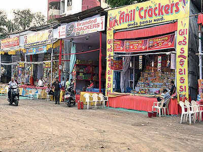 Firecracker vendors seize footpaths of major roads in Surat | Surat ...