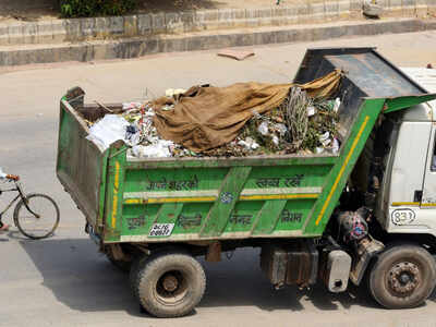 Can’t carry waste in open trucks in Delhi | Delhi News - Times of India
