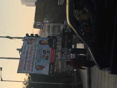 illegal hoarding covering a vital traffic signal - Times of India