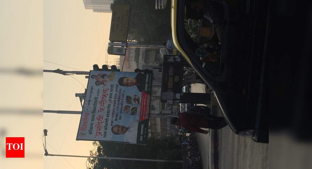 illegal hoarding covering a vital traffic signal - Times of India