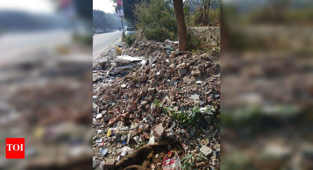 Debris on roadside - Times of India