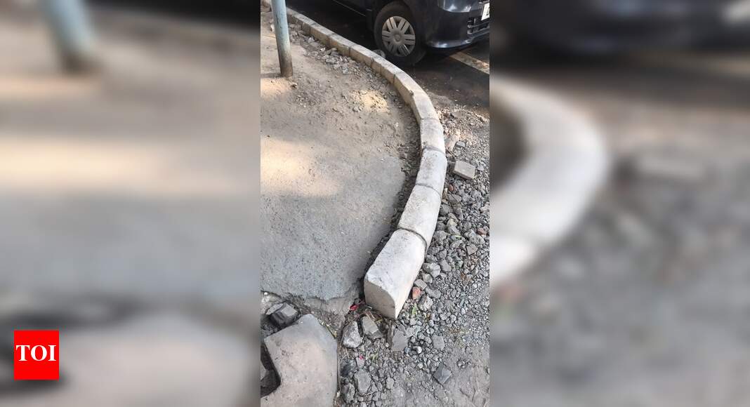 Footpath repair incomplete - Times of India