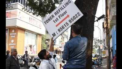 NMC starts removing advt boards, posters from trees | Nagpur News ...
