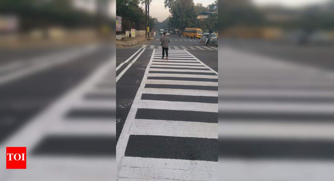 Zebra crossing ends in middle of road - Times of India