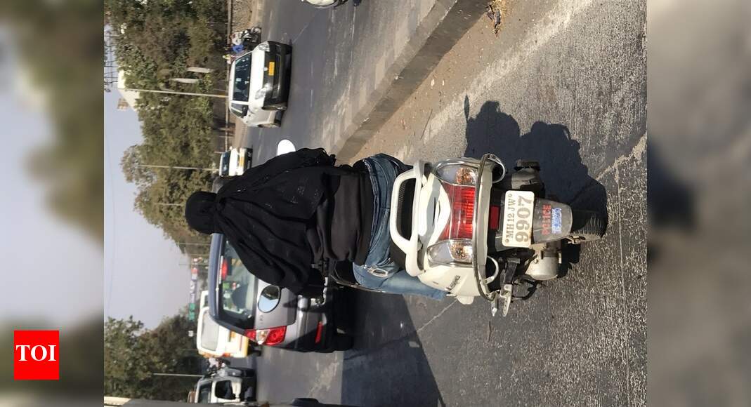 Police riding without Helmet - Times of India