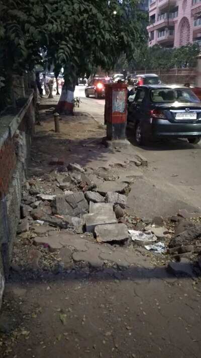 Broken footpath - Times of India
