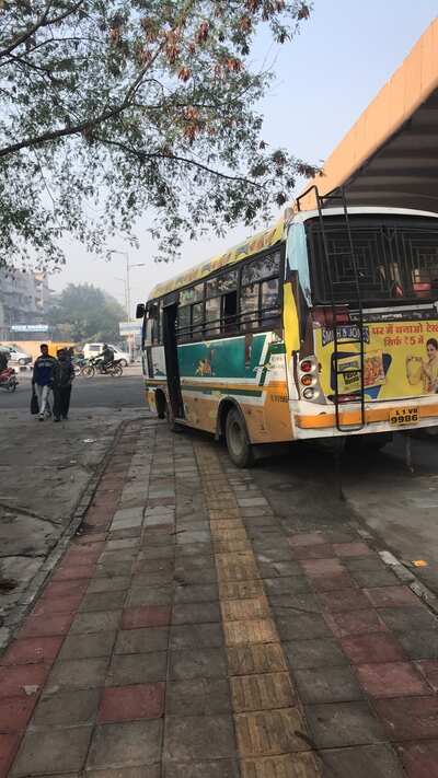 Vehicles drive on footpath - Times of India