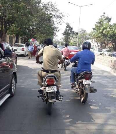 Hyderabad police cellphone driving without helmet. - Times of India