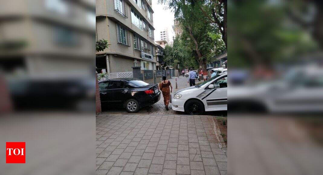 Car parking daily blocking footpaths - Times of India