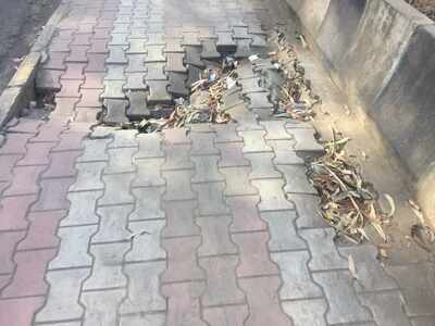 Damage footpath - Times of India