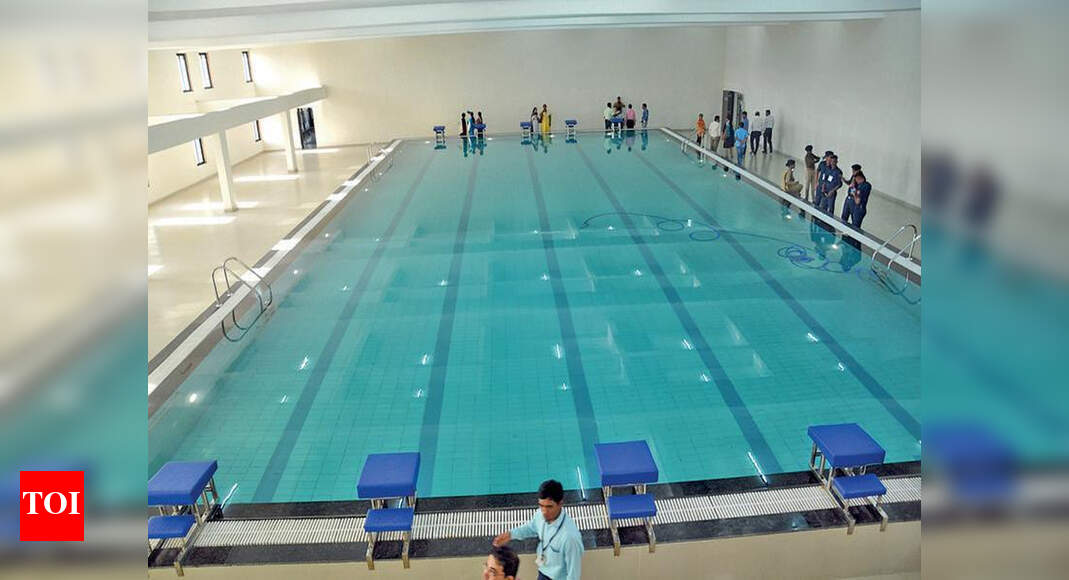 VNSGU gets new synthetic track, swimming pool | Surat News - Times of India