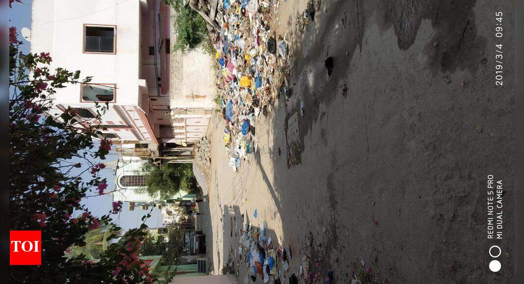 spilled garbage on the road - Times of India