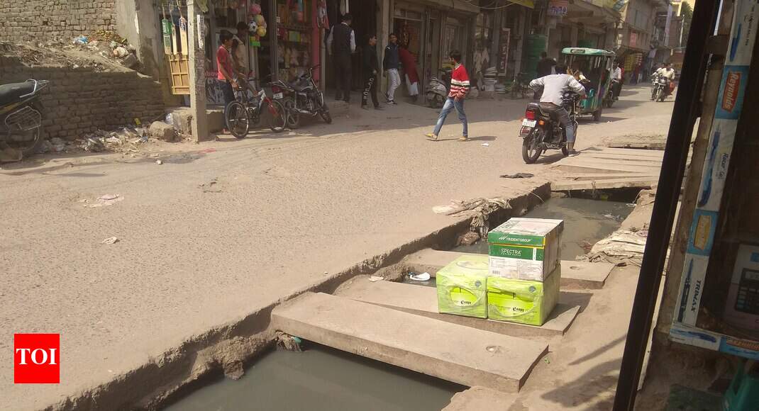 Open drains alongside road - Times of India