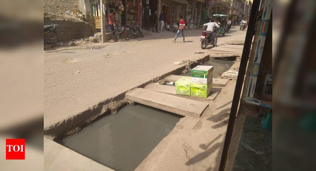 Open drains alongside road - Times of India