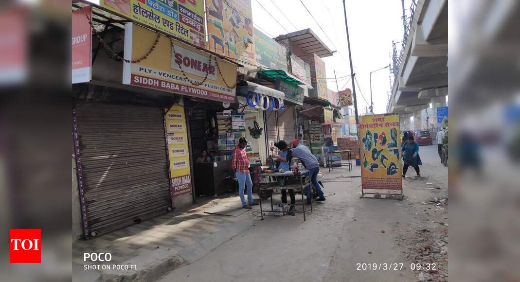Footpath captured by shops - Times of India