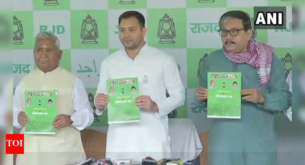 RJD releases manifesto, promises reservation - Times of India