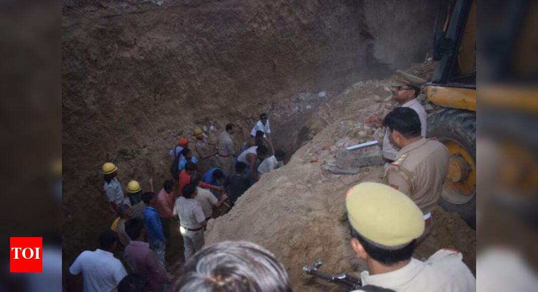 Two killed, three injured after mound of earth collapses at under ...