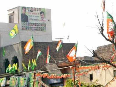 Support wave flies with party flags on rooftops in Haryana - Times of India
