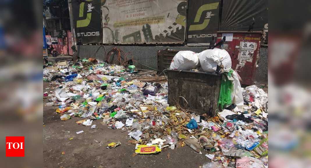 garbage strewn all over the road - Times of India
