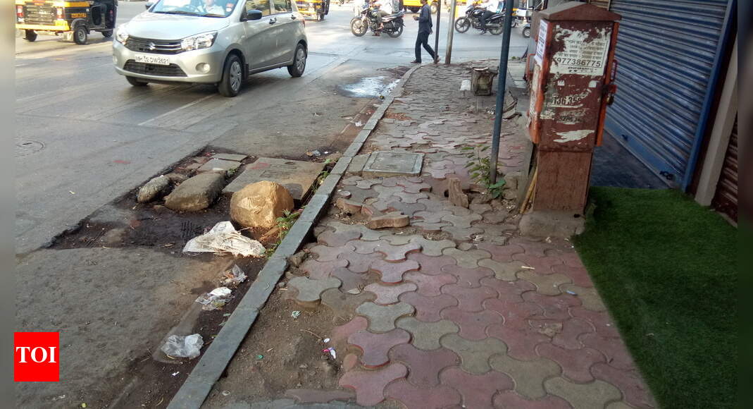 Footpath damaged - Times of India