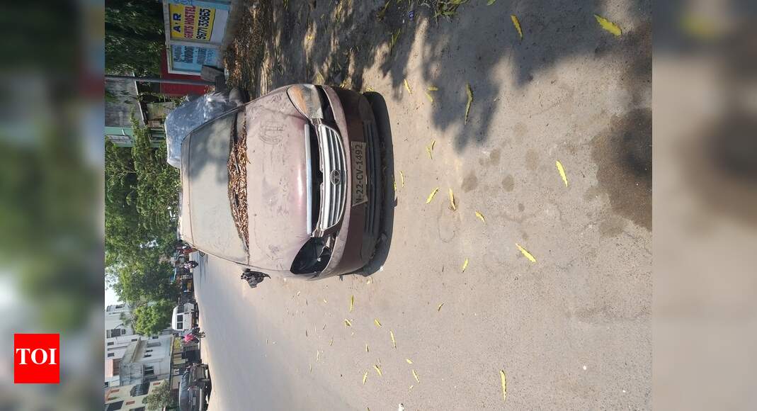 unclaimed car for over a year and encroachment - Times of India