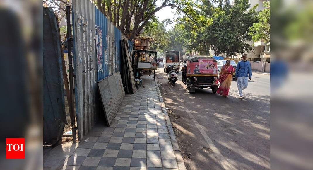 footpath encroachment - Times of India
