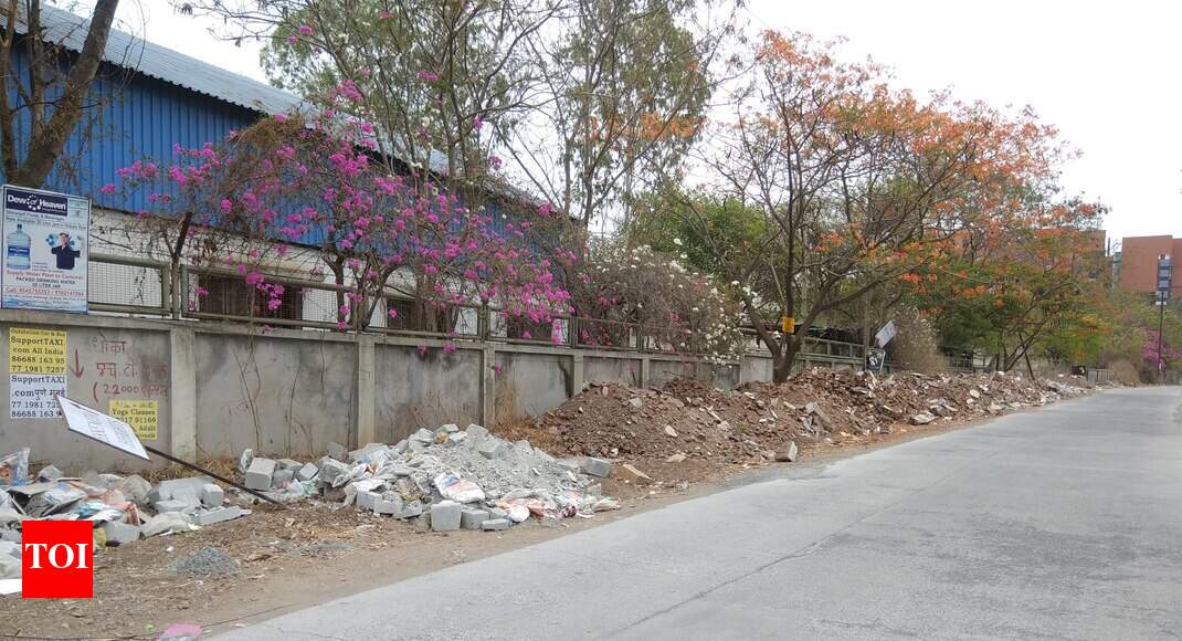 construction debri pile-up - Times of India