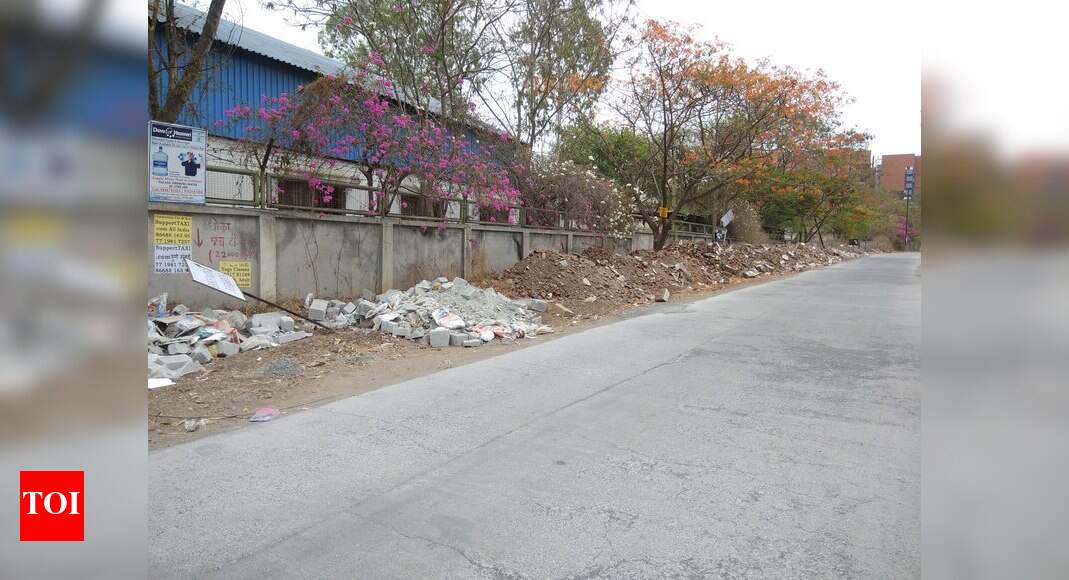 construction debri pile-up - Times of India