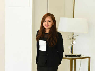 Joy strikes a pose at the launch of Drapes and Dreams, a home decor ...