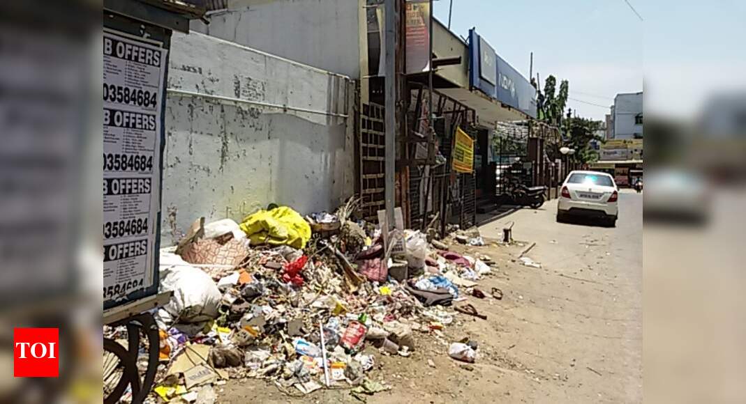 Garbage dumped in open - Times of India