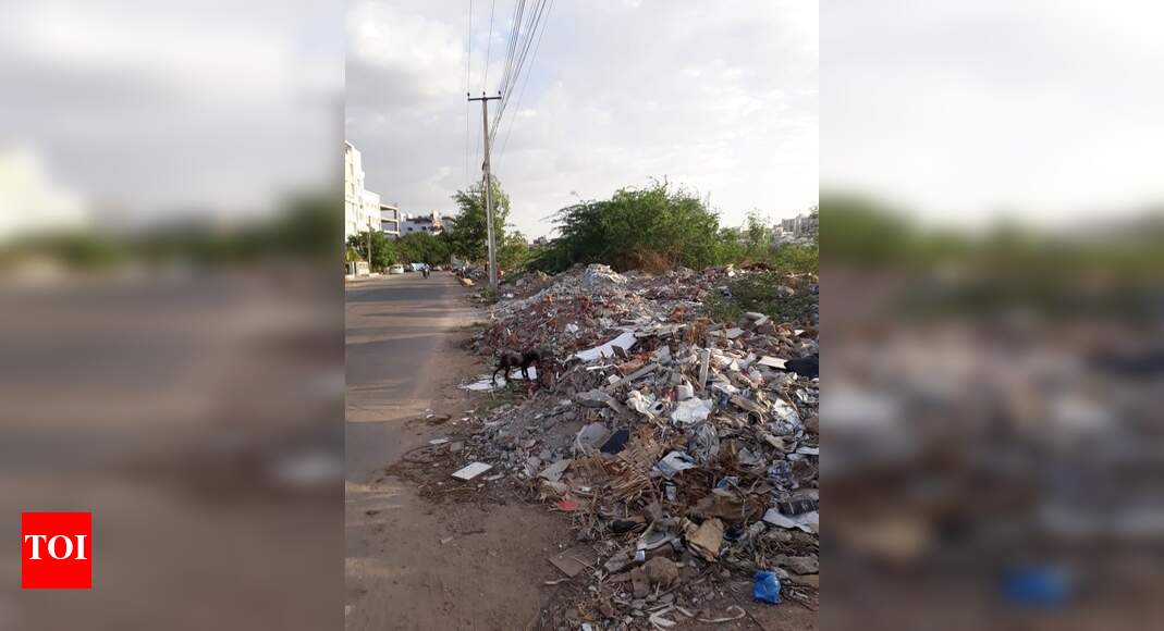 open air garbage dumping amidst residential space - Times of India