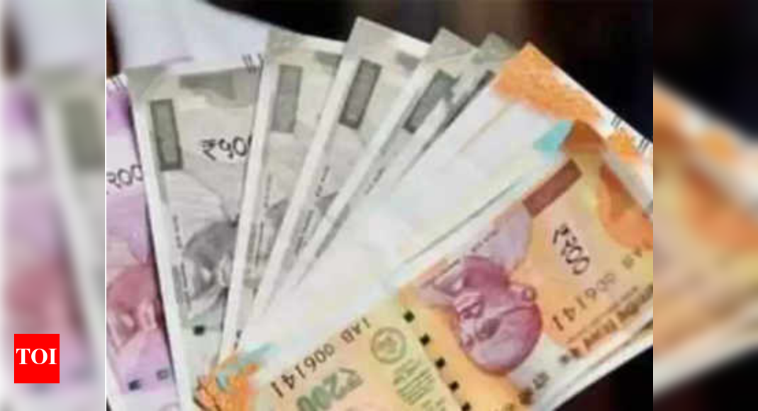 Rupee slips 26 paise to 69.06 vs USD in early trade - Times of India