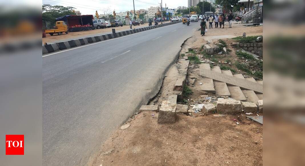 footpath completely damaged - Times of India