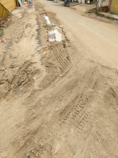 Road turns Slush & Mud for not Relaying Road - Times of India