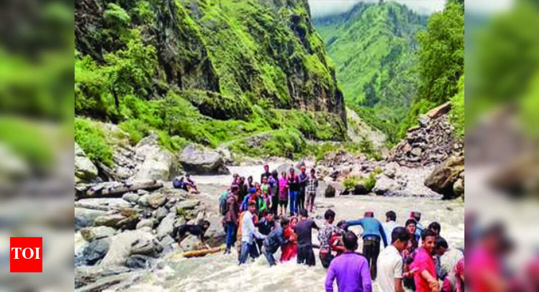Sans bridge, people risk their lives to cross flooded Supin river ...