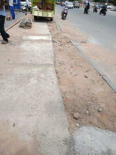 risky uneven footpath - Times of India