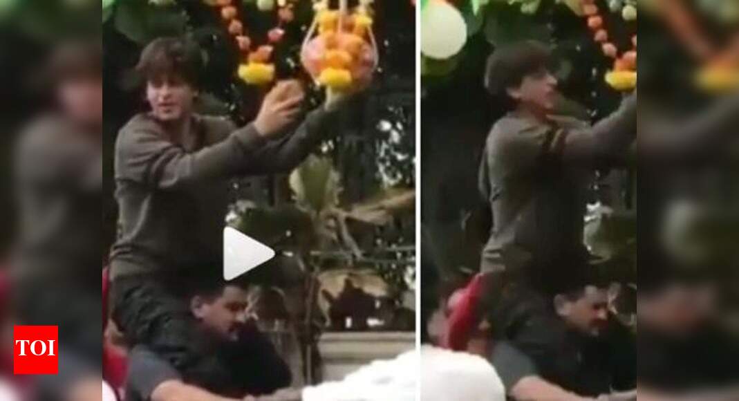 Watch: Shah Rukh Khan climbs on his bodyguard's shoulder to celebrate ...