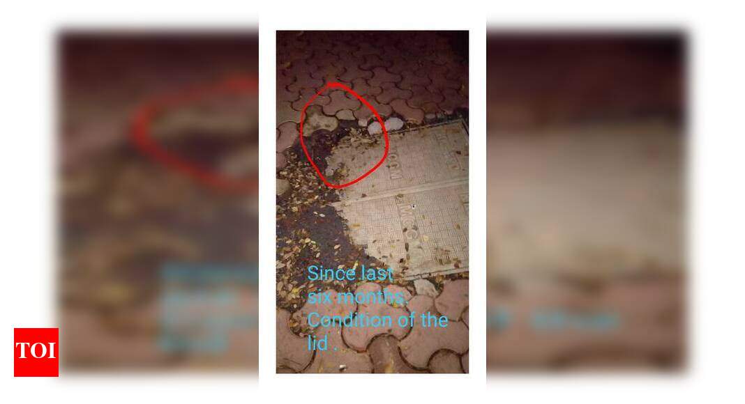 uneven footpath and gutter's lid. - Times of India