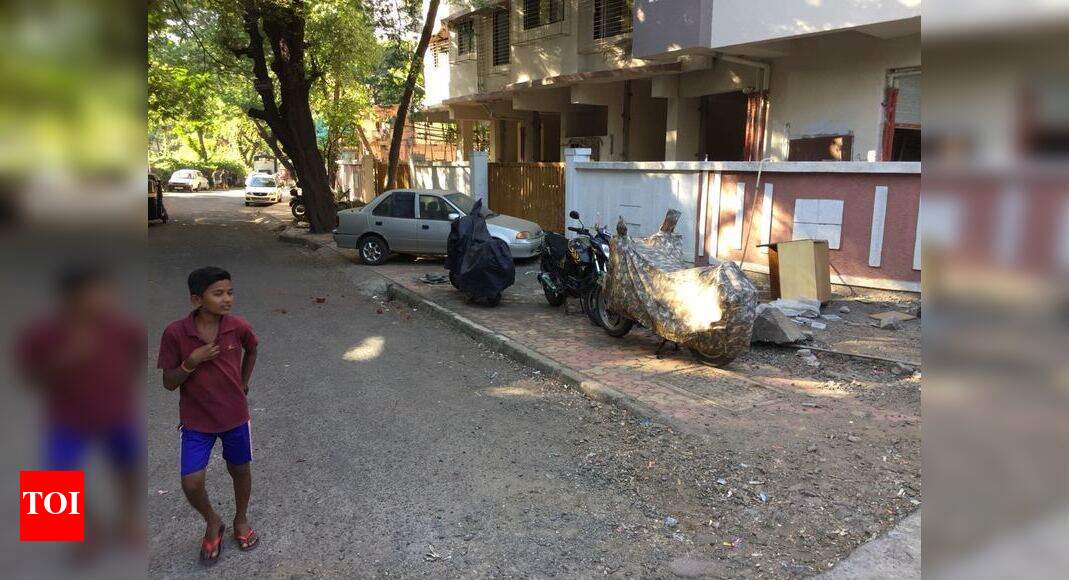 Unauthorised Parking outside compound - Times of India