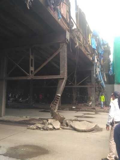 Reay Rd station side bridge with big slum on it. - Times of India