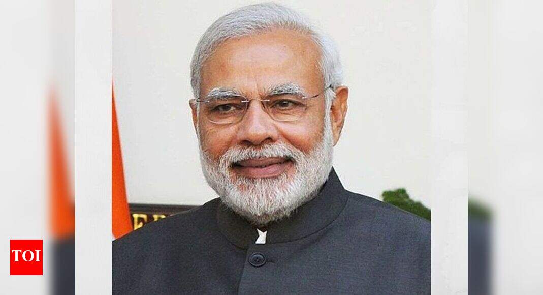 Pictorial biography to chronicle Modi's journey - Times of India