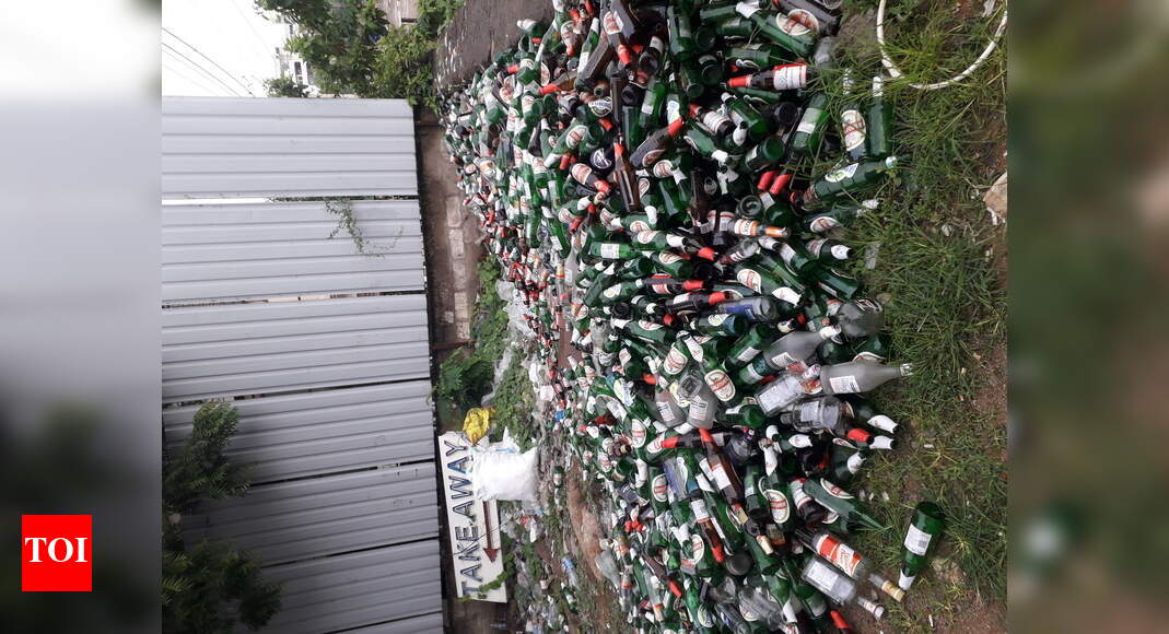 garbage of liquor bottles - Times of India
