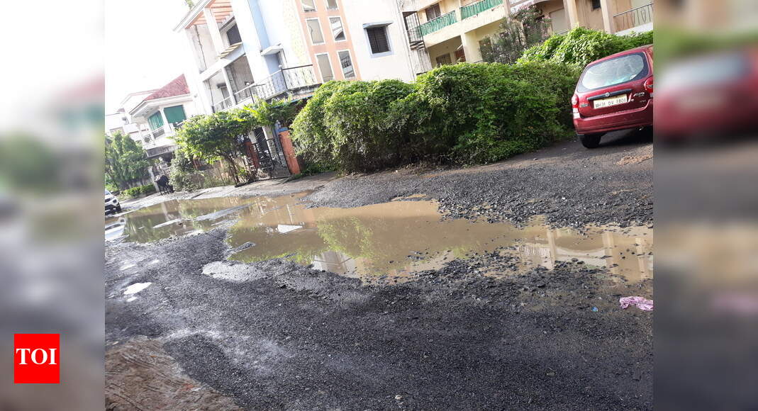 road full of potholes.still neglected! - Times of India