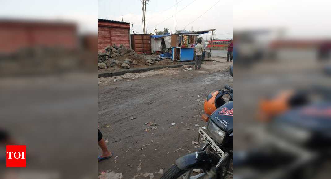 Encroachment on area demarcated for road. - Times of India